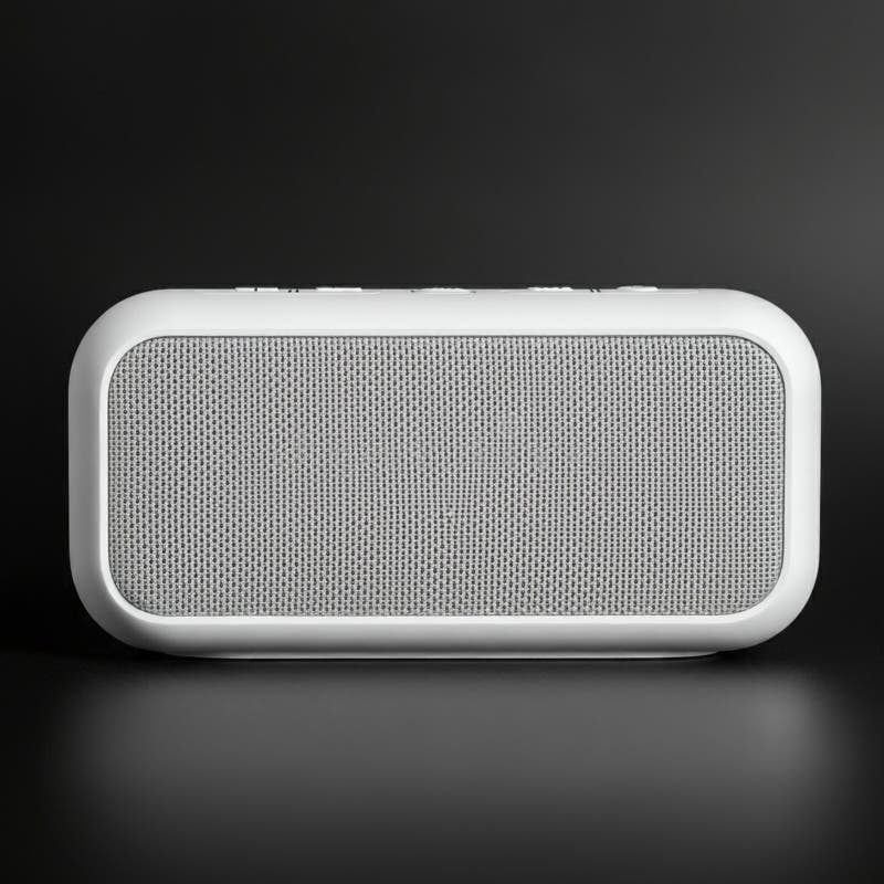A Compact Rectangular Speaker with a Sleek White Plastic Casing. the ...