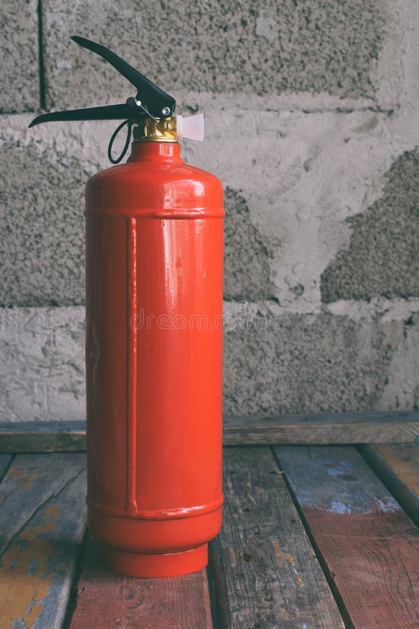 Compact Red Fire Extinguisher for Auto or Home on Grey Background. for ...