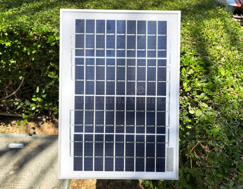 Compact Solar Panel among Green Bushes. Concepts of Sustainable ...