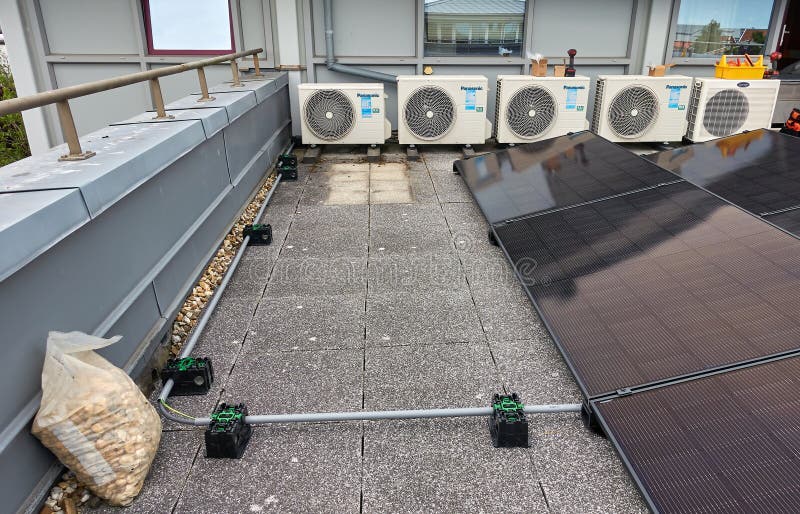 Compact Solar Panel System Installation on Modern Rooftop Terrace with ...