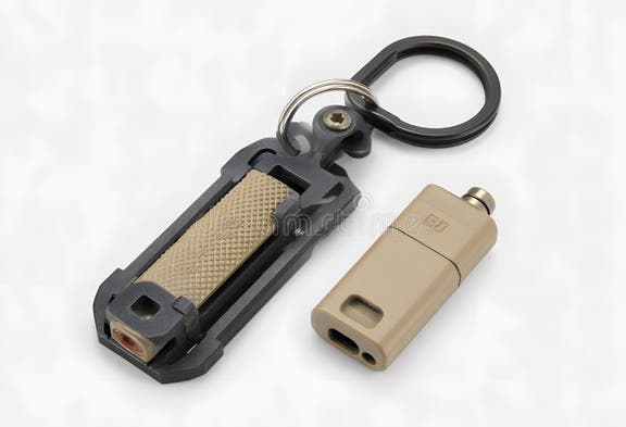 Compact Tactical Key Chain with a Tan-colored Lighter Stock ...