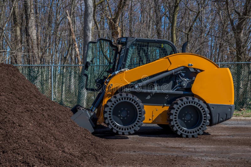 Compact track loader mulch stock photo. Image of industrial - 271563764