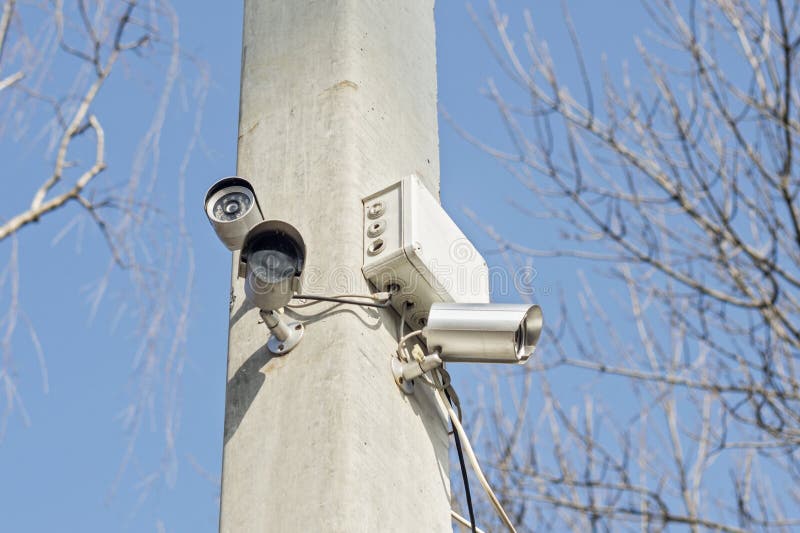 Compact Video Surveillance Cameras on Support Post in Public Areas on ...
