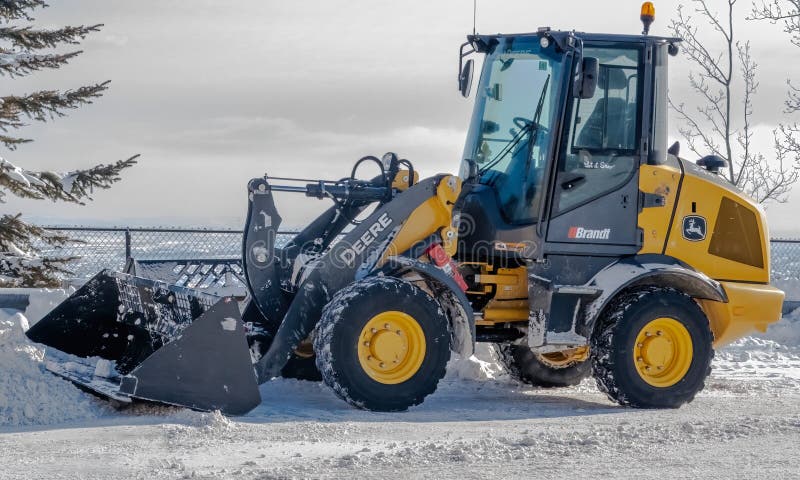 A Compact Wheel Loader, Parked during the Winter Season, Exhibits Its ...