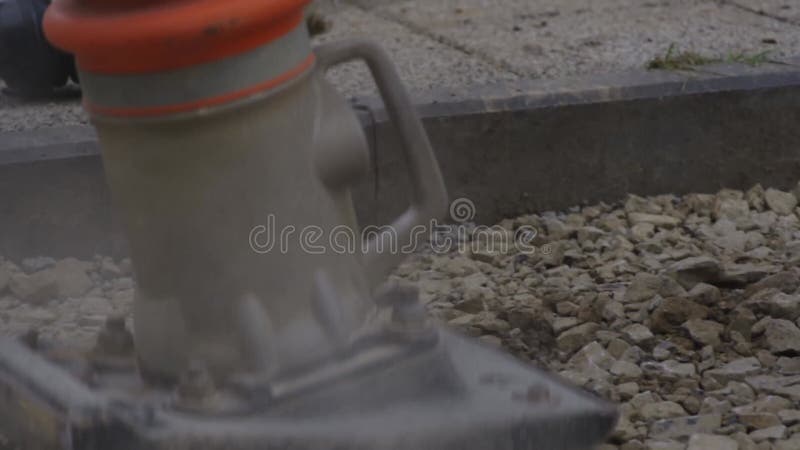 Compaction of Gravel Sub-base with a "jumper" (compactor with a "foot ...
