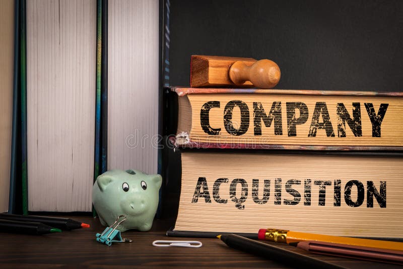 Company and Acquisition. Stack of Books on a Wooden Shelf Stock Image ...