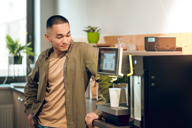 Company Employee Preparing a Caffeinated Beverage at Work Stock Photo ...