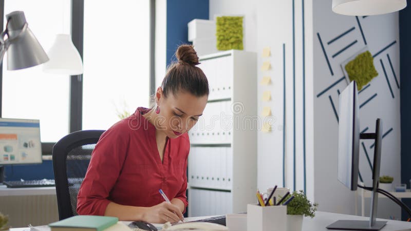 Company Employee Taking Notes on Charts Documents Stock Image - Image ...
