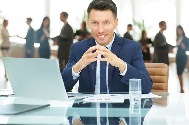 Company Representative at the Desk on Office Background Stock Photo ...