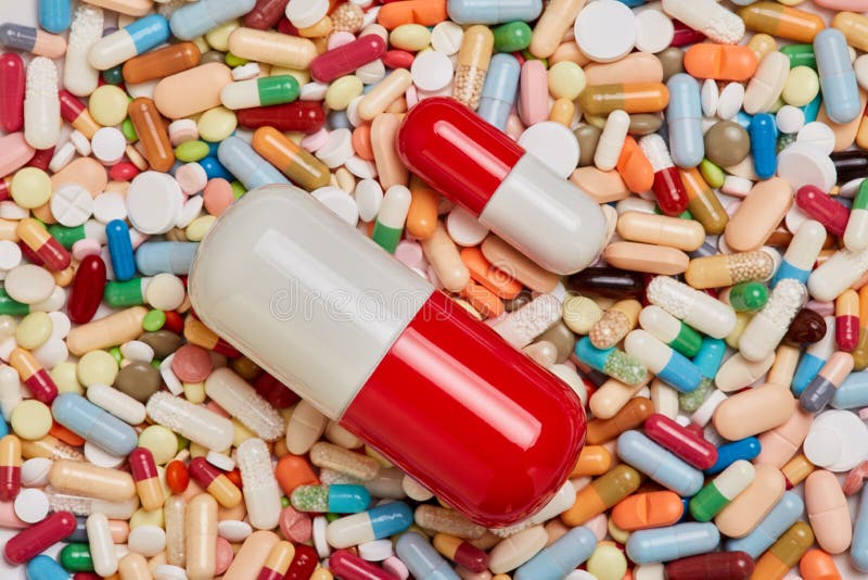 Compare Medications of Different Sizes Stock Photo - Image of drugs ...