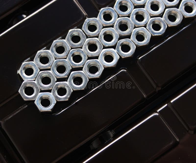 A Compartment Filled with Iron Nuts of the Same Diameter Stock Photo ...