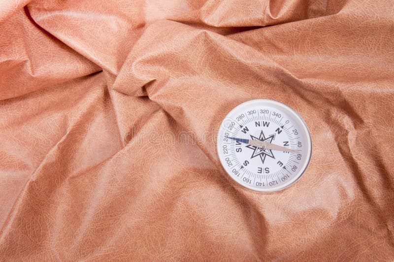 Compass against the skin stock photo. Image of leather - 20049928