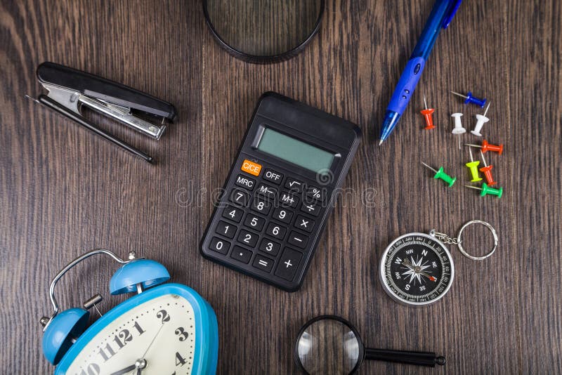 Compass, Alarm Clock, Magnifier and Calculator Stock Photo - Image of ...