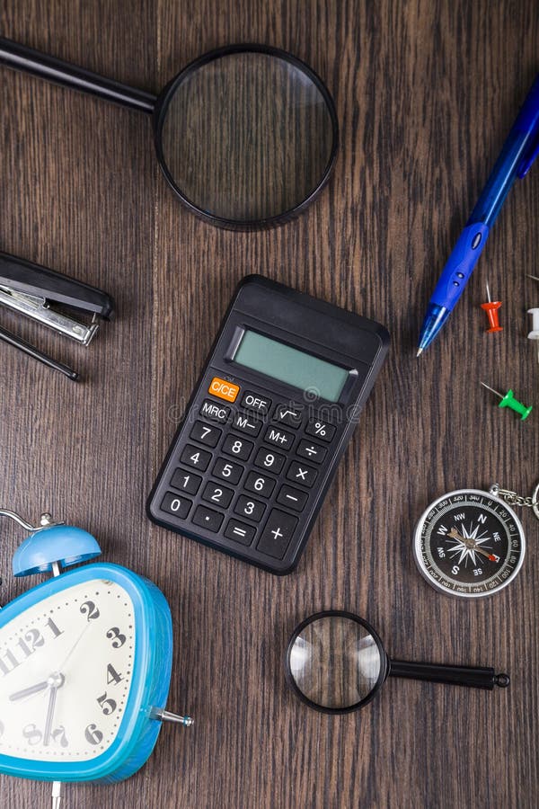 Compass, Alarm Clock, Magnifier and Calculator Stock Photo - Image of ...