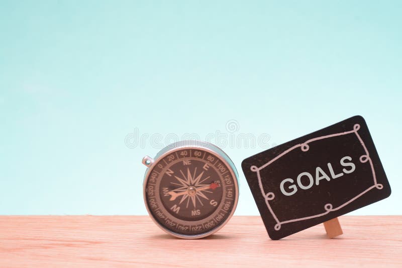 A Compass Alongside the Word Goals Represents a Navigational Tool for ...