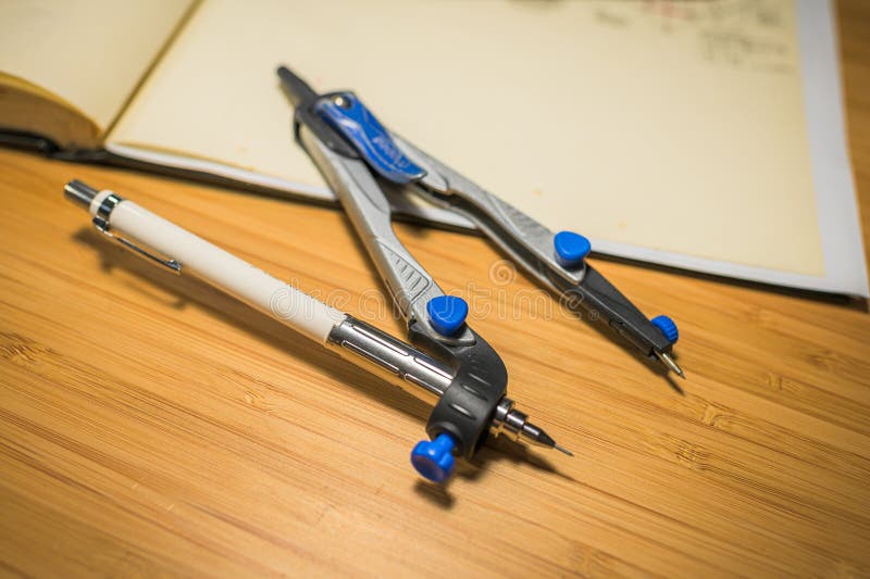 A Compass Resting on a Study Table. Stock Image - Image of exam ...