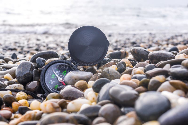Compass on the beach stock photo. Image of travel, beach - 153636338
