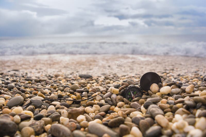 Compass on the beach stock photo. Image of discovery - 154494692