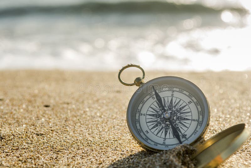 Compass on the beach stock photo. Image of discovery - 83429834