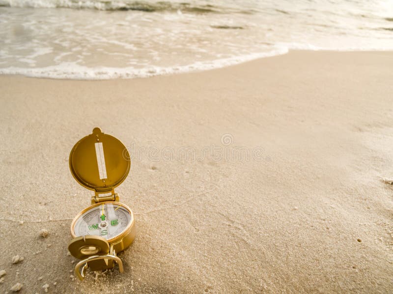 Compass on the beach stock photo. Image of azimuth, exploration - 77480986