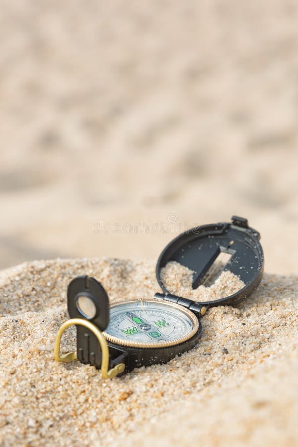 Compass in a beach sand. stock image. Image of expedition - 91906229