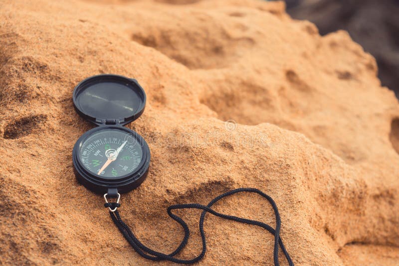 Compass on the beach stock image. Image of orientation - 388232843