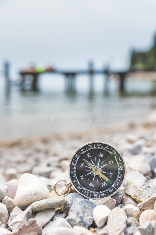 Compass on the Beach, Small Stones, Text Space Stock Photo - Image of ...