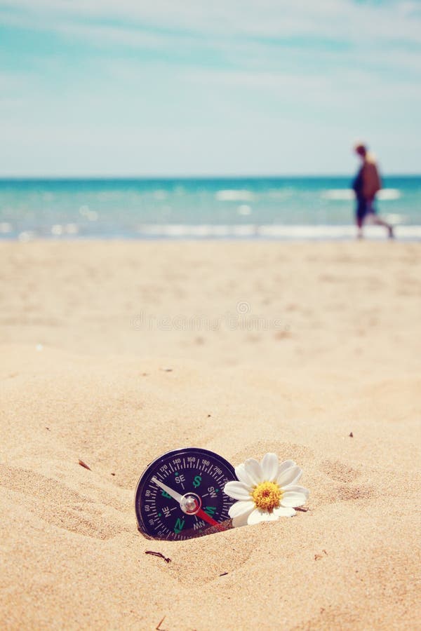 Compass On The Beach With Sand And Sea Stock Image - Image of adventure ...