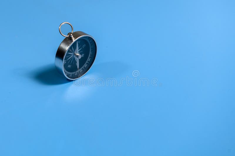 Compass on Blue Background with Copy Space. Direction Concept Stock ...