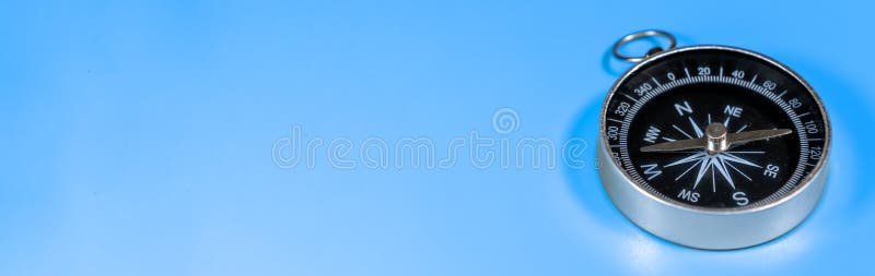 Compass on Blue Background with Copy Space. Direction Concept Stock ...