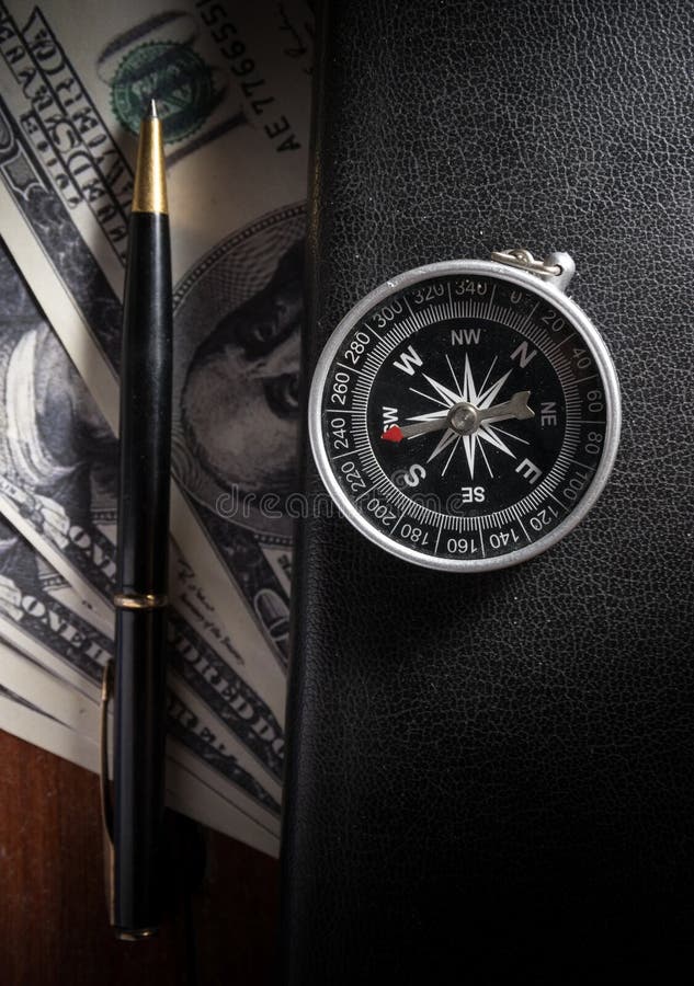 Compass on Book with Pen and Money. Stock Image - Image of finding ...