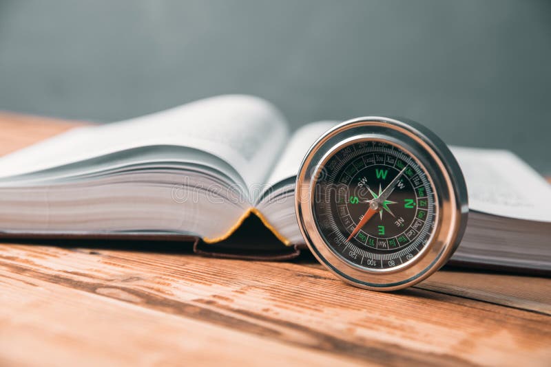 Compass and an old book stock photo. Image of direction - 19160960