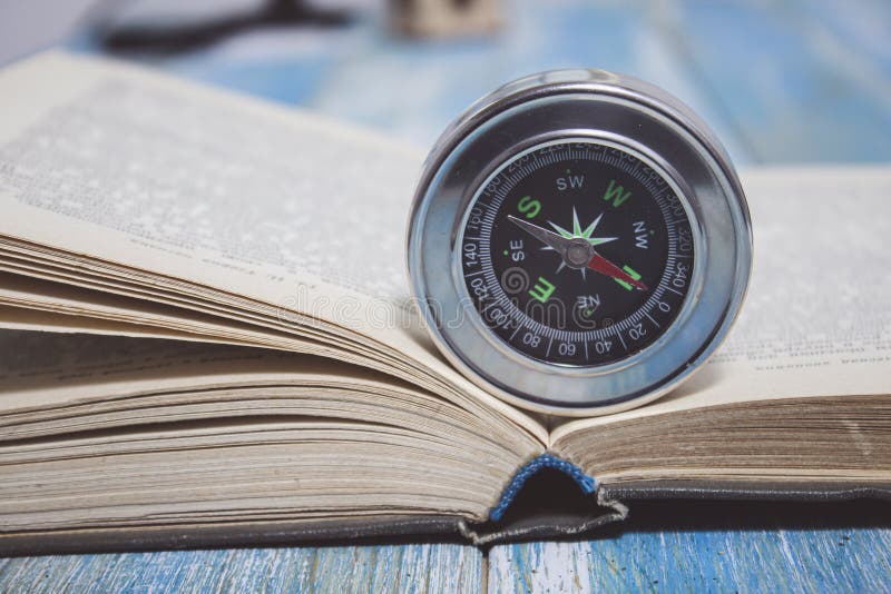 Compass and Book on the Table Stock Photo - Image of stylish, concept ...