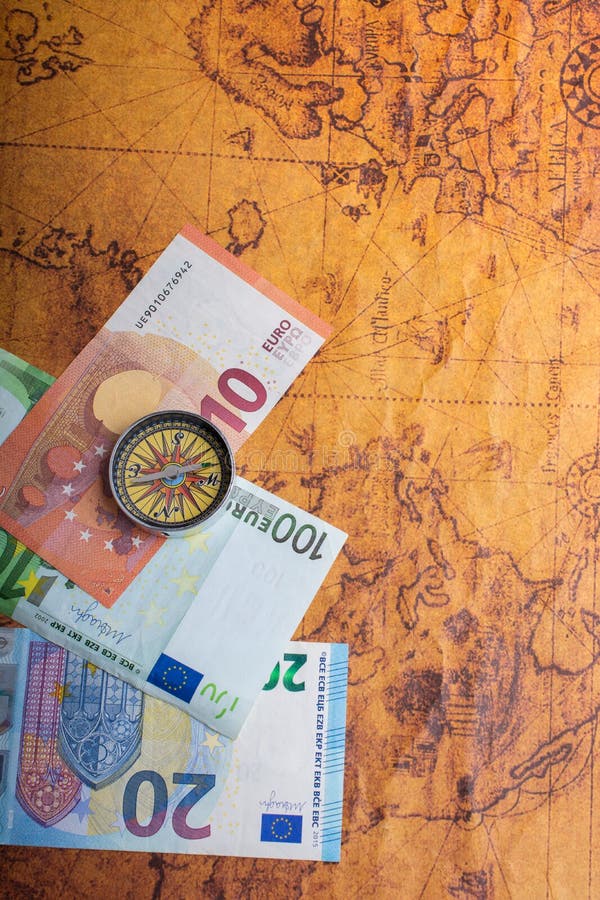 Compass beside a Box and Euro Banknotes on an Old Map Stock Photo ...