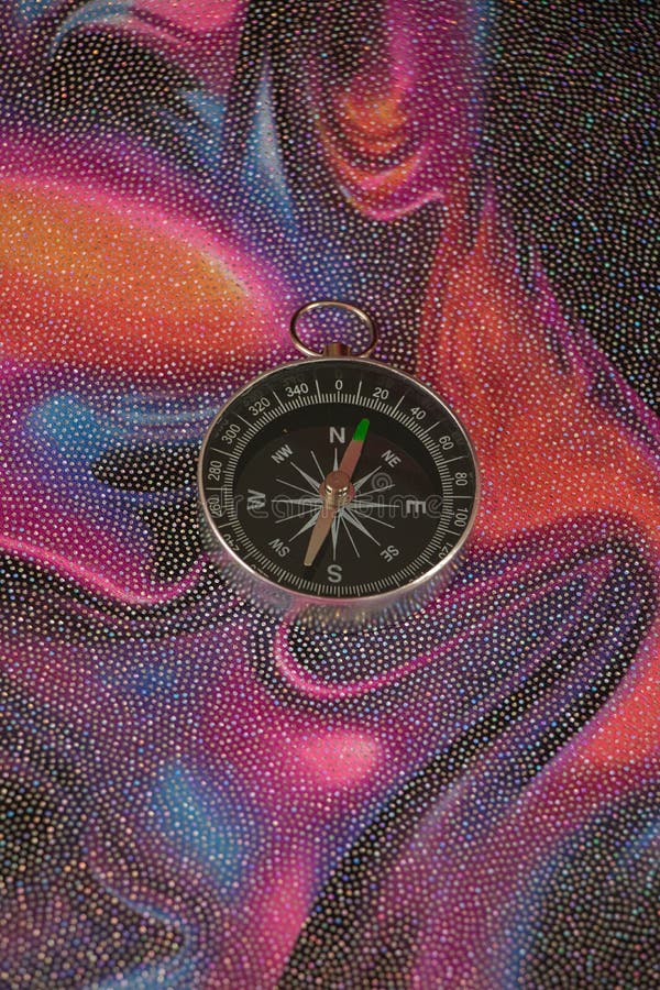 Compass on a Bright Multi-colored Background, Close-up Stock Image ...