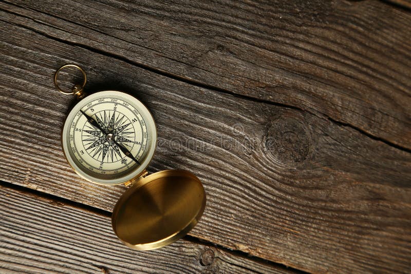 Compass on Brown Wooden Background. Stock Image - Image of background ...