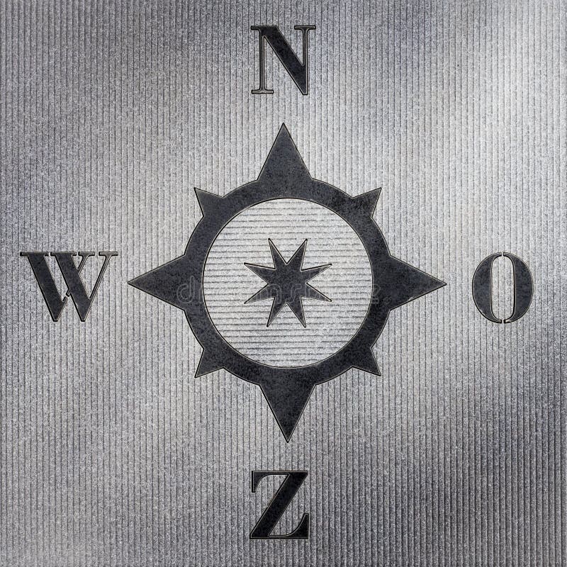 Compass card cut in stone stock photo. Image of artistic - 28944150