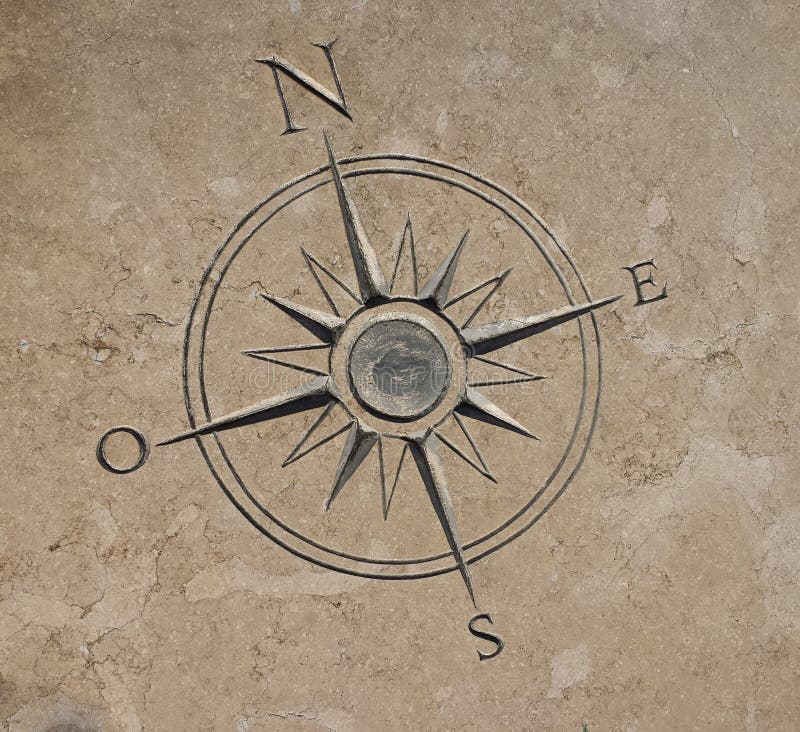 Compass carved in stone stock photo. Image of adventure - 59992364