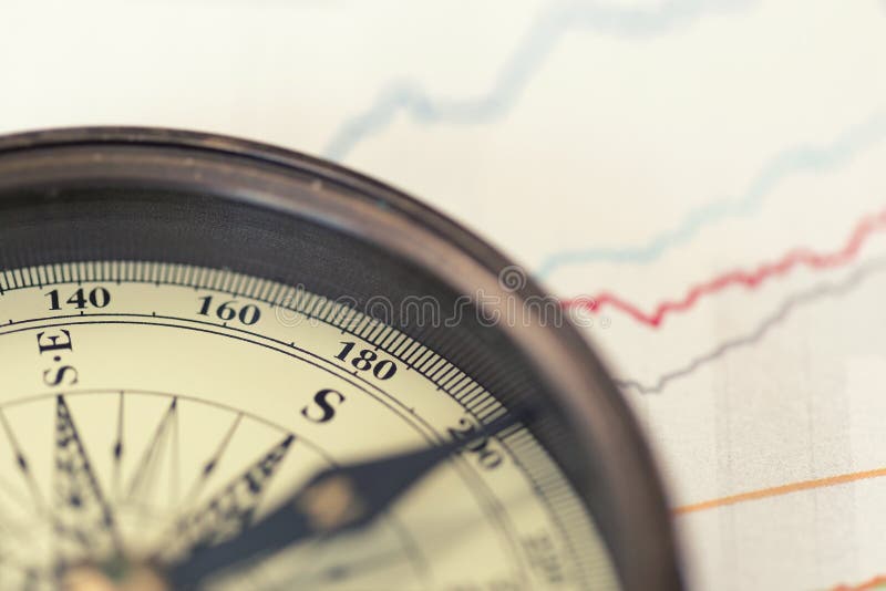 A compass on charts stock photo. Image of data, chart - 73696632