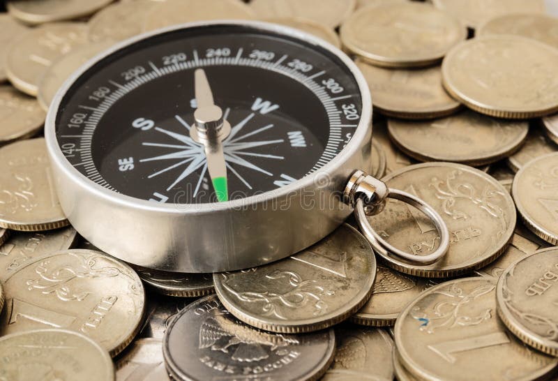 Compass on a coins stock photo. Image of exchange, compass - 133016520
