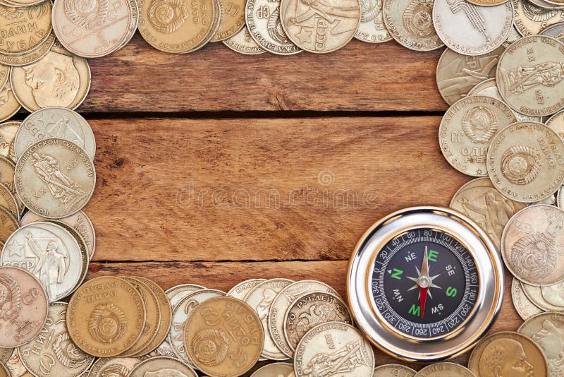 Compass and coins frame stock photo. Image of wood, west - 70736448