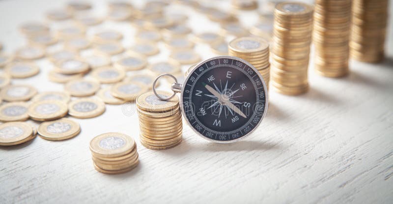 Compass and Coins on the White Desk Stock Image - Image of cash ...