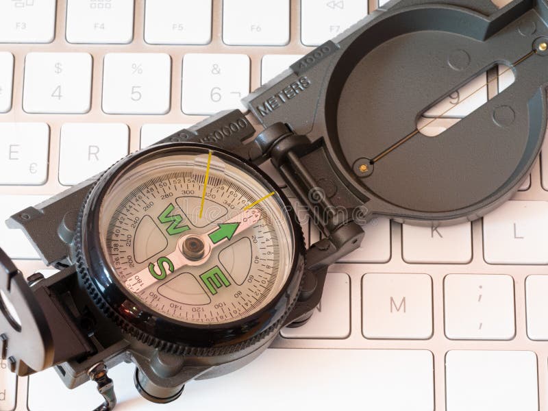 Compass on a Computer Keyboard Stock Photo - Image of discovery, west ...