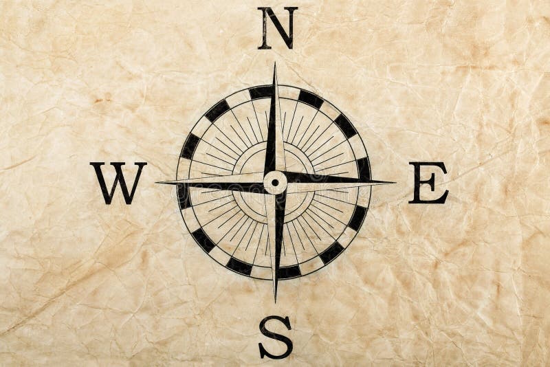 Compass on creased paper stock photo. Image of travel - 36517516