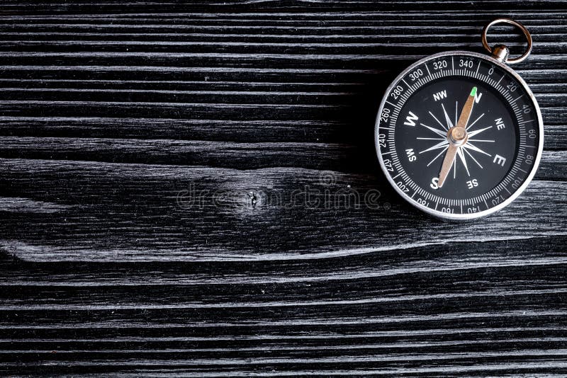 Compass on Dark Wooden Background Concept Direction Motion Top V Stock ...