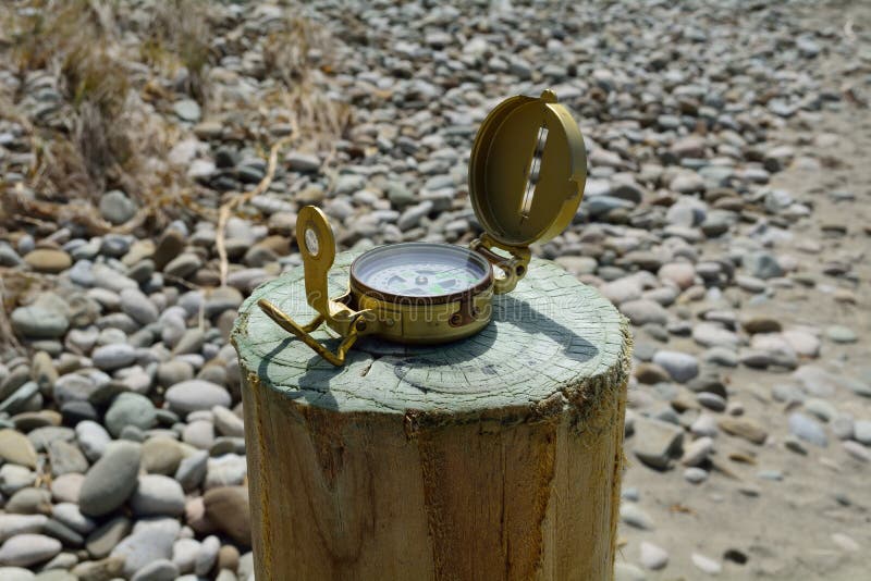 Compass at the Edge of the Beach Stock Image - Image of summer, ocean ...