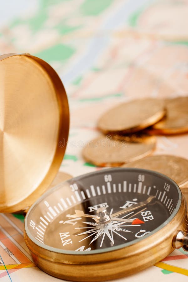 Compass and golden coins stock image. Image of discovery - 37422529