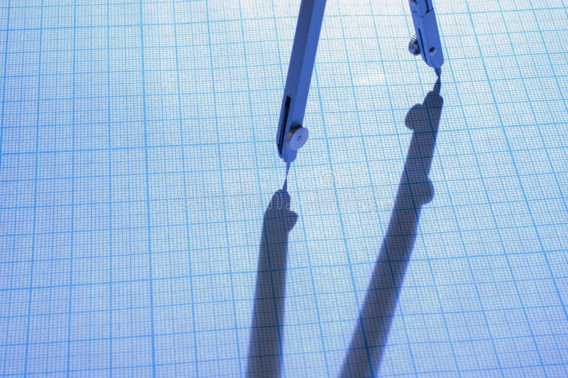 Compass on graph paper stock photo. Image of shape, reflection - 79042158