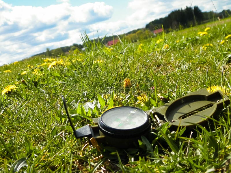 Compass on Grass - Traveling, Exploration and Navigation Stock Photo ...