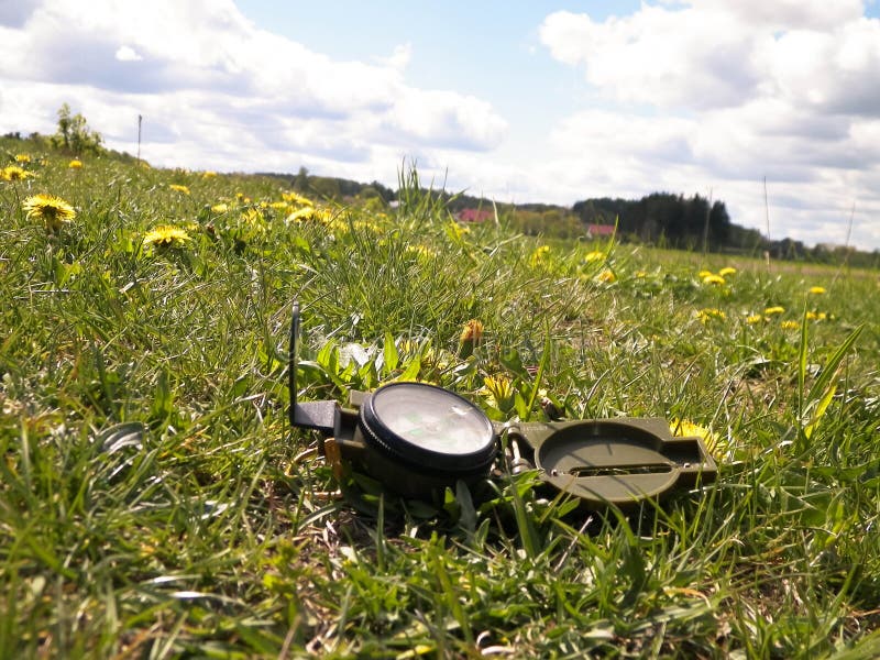 Compass on Grass - Traveling, Exploration and Navigation Stock Photo ...